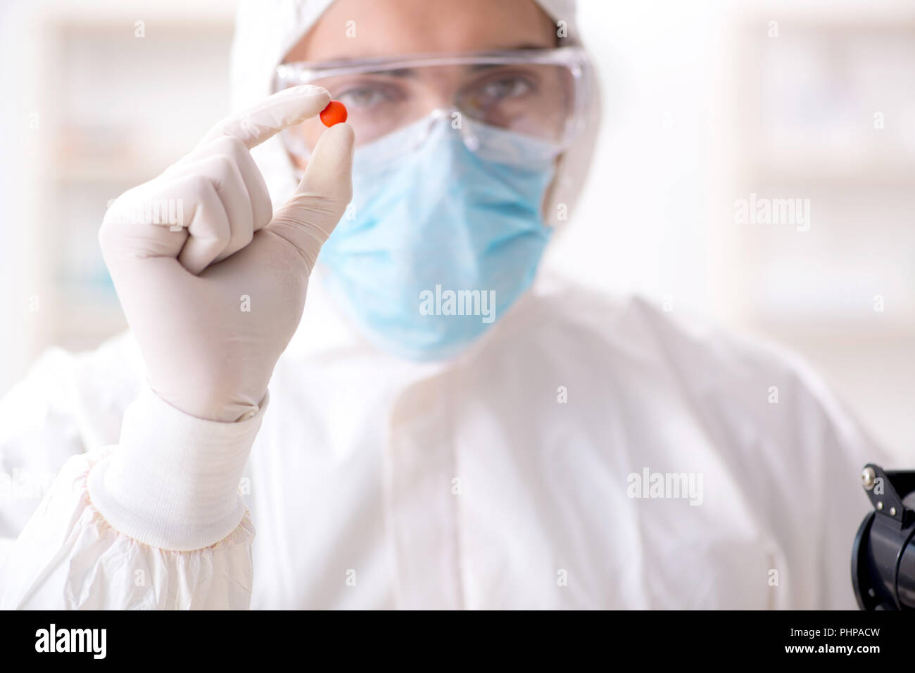 Lab assistant in drug synthesis concept Stock Photo - Alamy