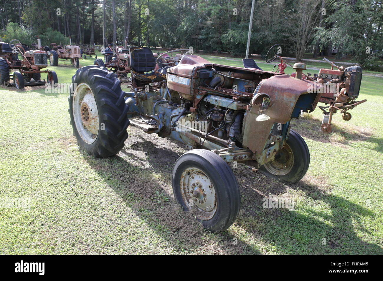 old rusty tractors in junkyard Stock Photo - Alamy