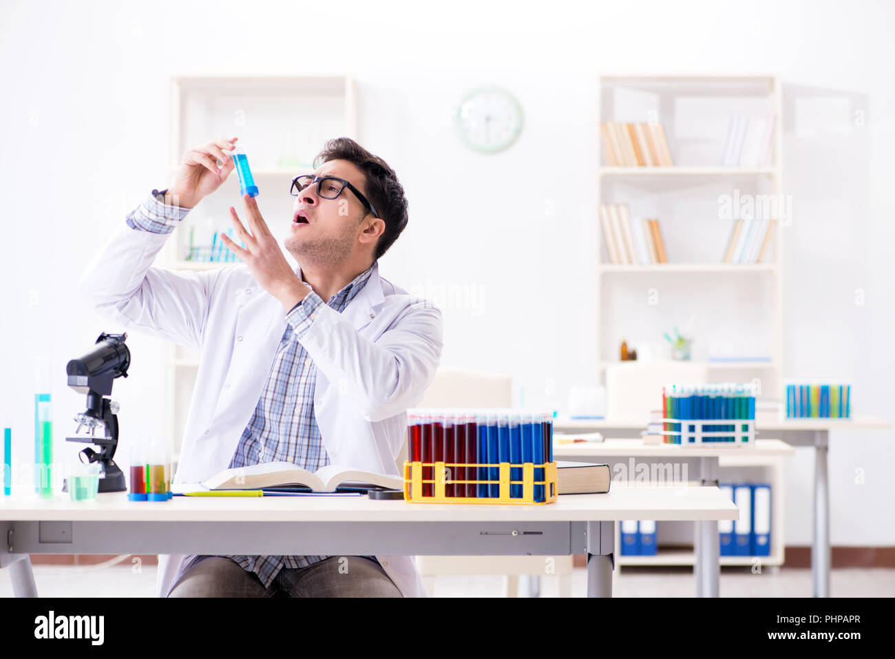 Chemistry student doing chemical experiments at classroom activi Stock ...