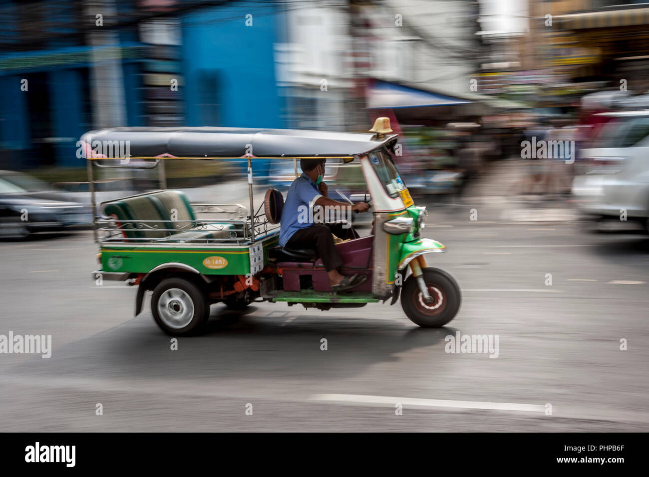 A tuk tuk moving on the streets of Bangkok Stock Photo - Alamy