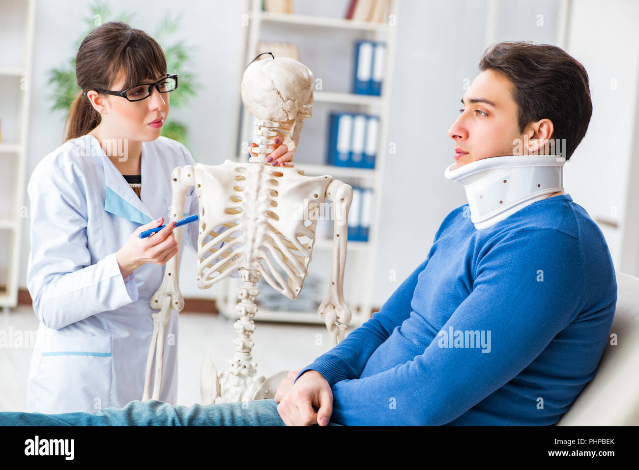 Doctor is explaining to patient with neck injury Stock Photo - Alamy