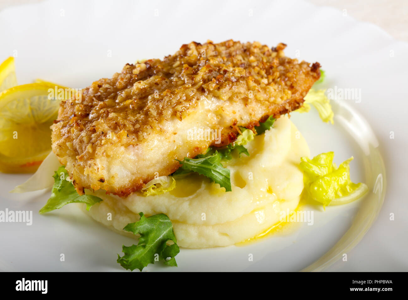 Baked Cod fish with mashed potato Stock Photo - Alamy