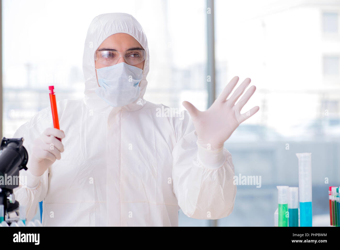 Man doctor checking blood samples in lab Stock Photo - Alamy