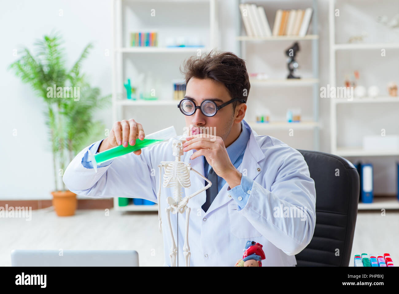 Funny doctor having fun in hospital lab Stock Photo - Alamy