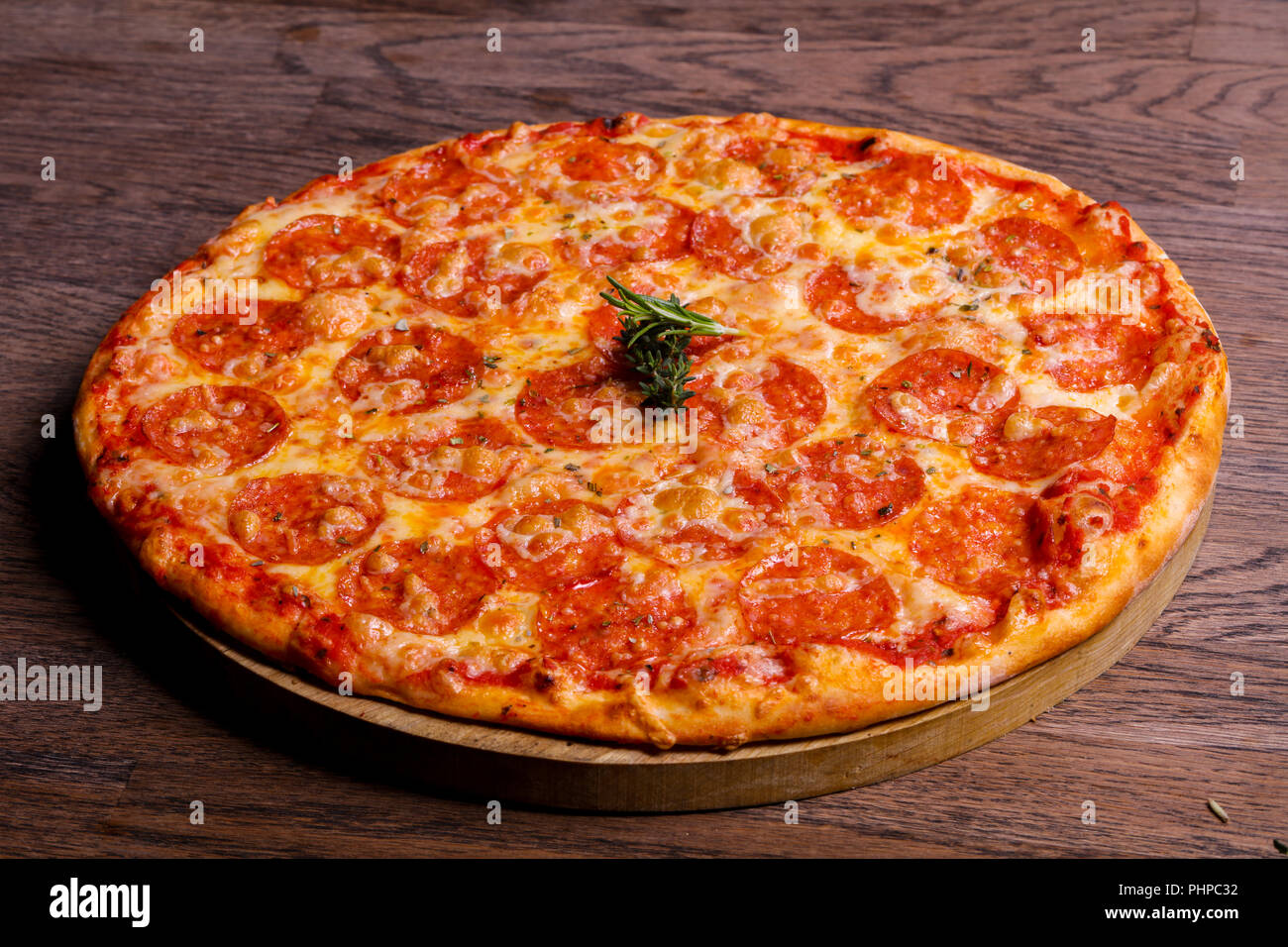 Hot Pepperoni pizza with cheese and tomato Stock Photo - Alamy
