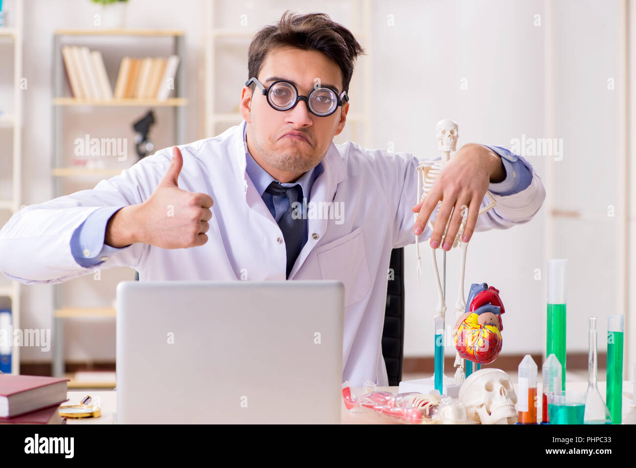 Funny doctor having fun in hospital lab Stock Photo - Alamy