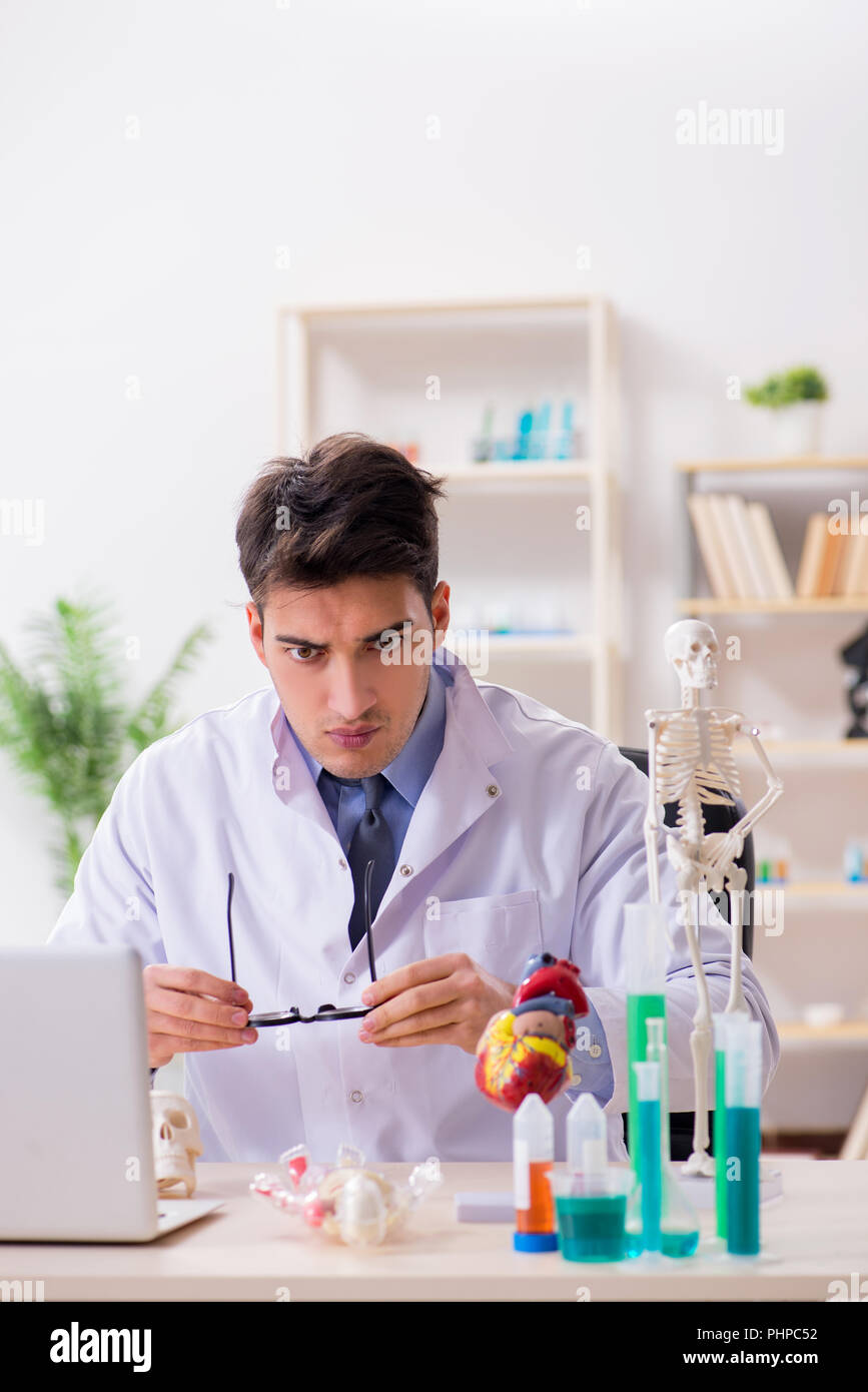 Funny doctor having fun in hospital lab Stock Photo - Alamy