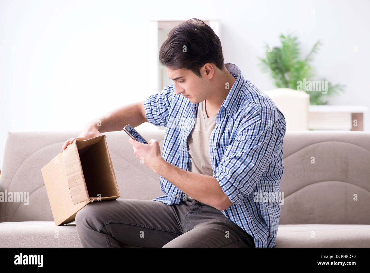 Man receiving empty parcel with stolen goods Stock Photo - Alamy