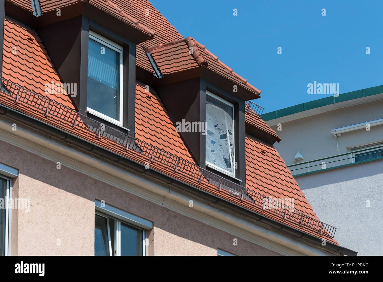 Broken fly screen on a roof window Stock Photo - Alamy