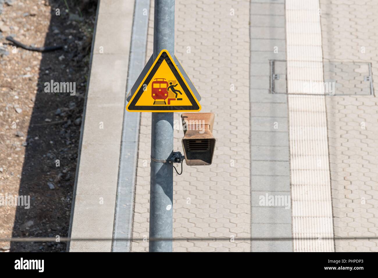 Traffic signs on the railway track: Risk of falling Stock Photo - Alamy