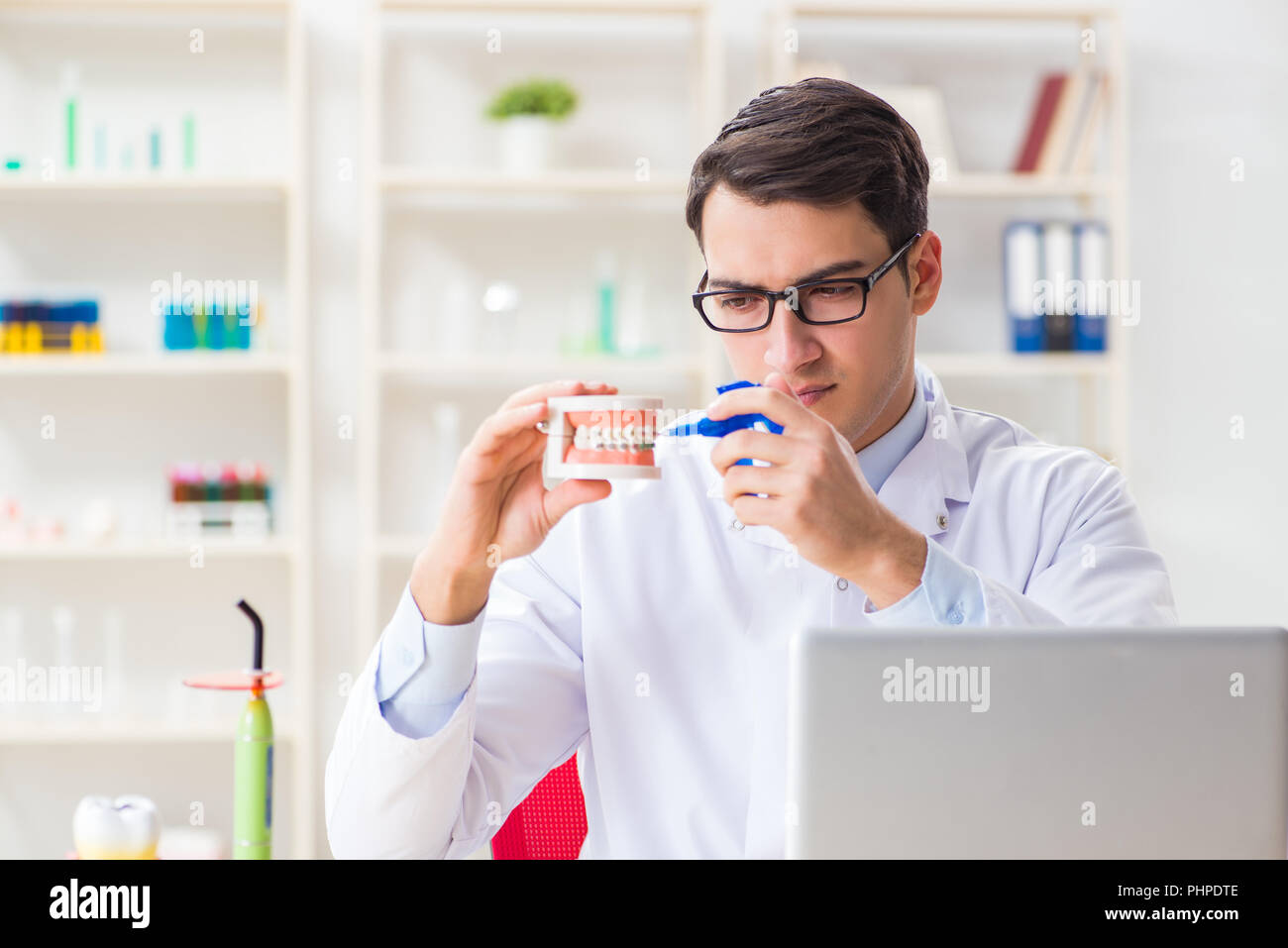 Young dentist working in the dentistry hospital Stock Photo - Alamy
