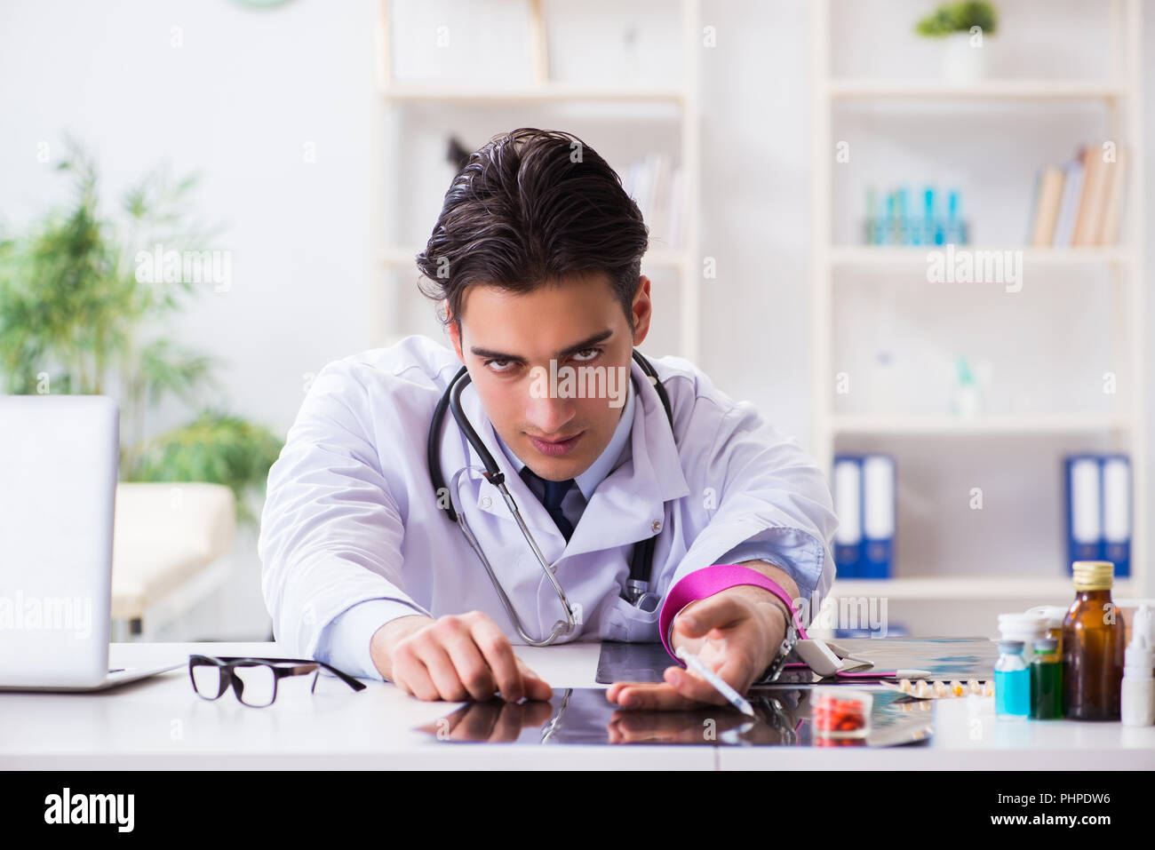 Doctor drug addict in the hospital Stock Photo - Alamy