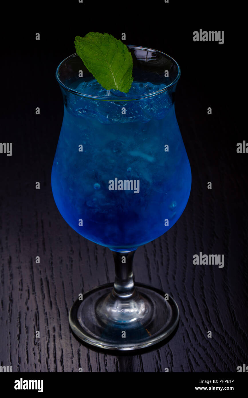 Sweet blue curacao cocktail with mint Stock Photo - Alamy