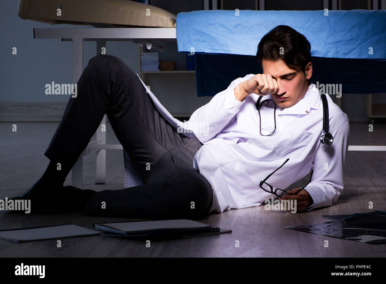 Doctor working night shift in hospital after long hours Stock Photo - Alamy
