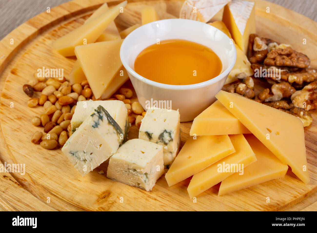 Cheese plate mix with honey Stock Photo - Alamy