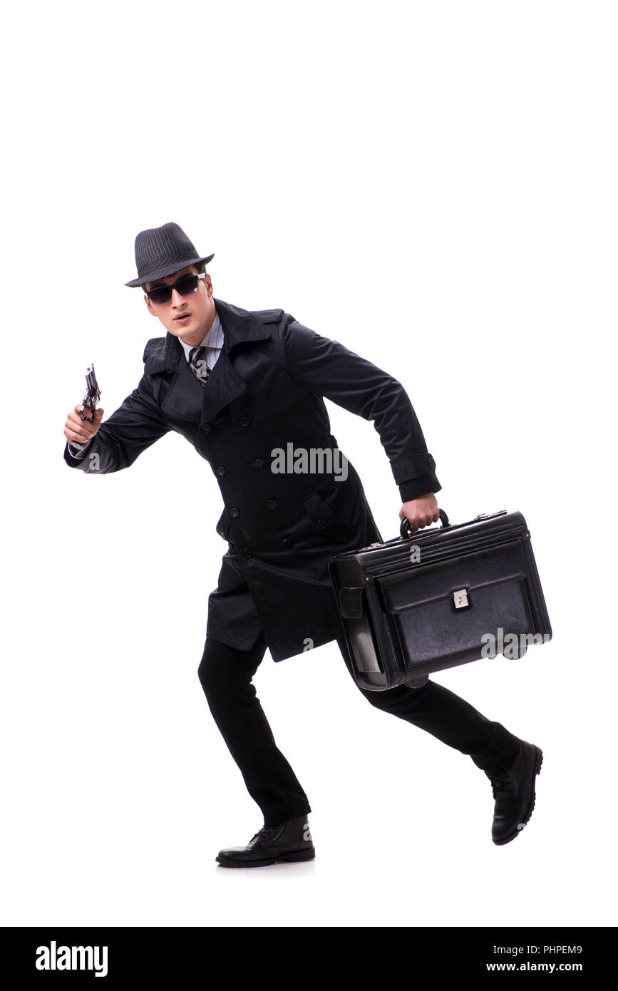 Man spy with handgun isolated on white background Stock Photo - Alamy