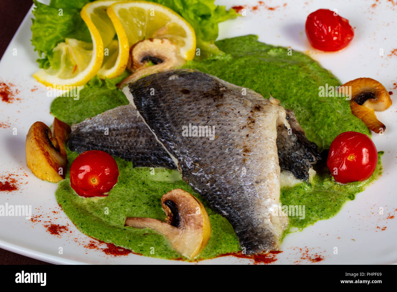Steamed Dorada fish fillet with sauce Stock Photo - Alamy