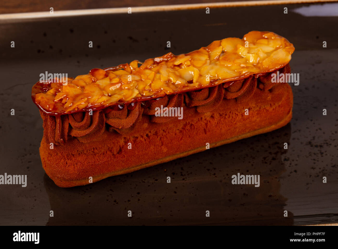 Tasty sweet Eclair with cream Stock Photo - Alamy