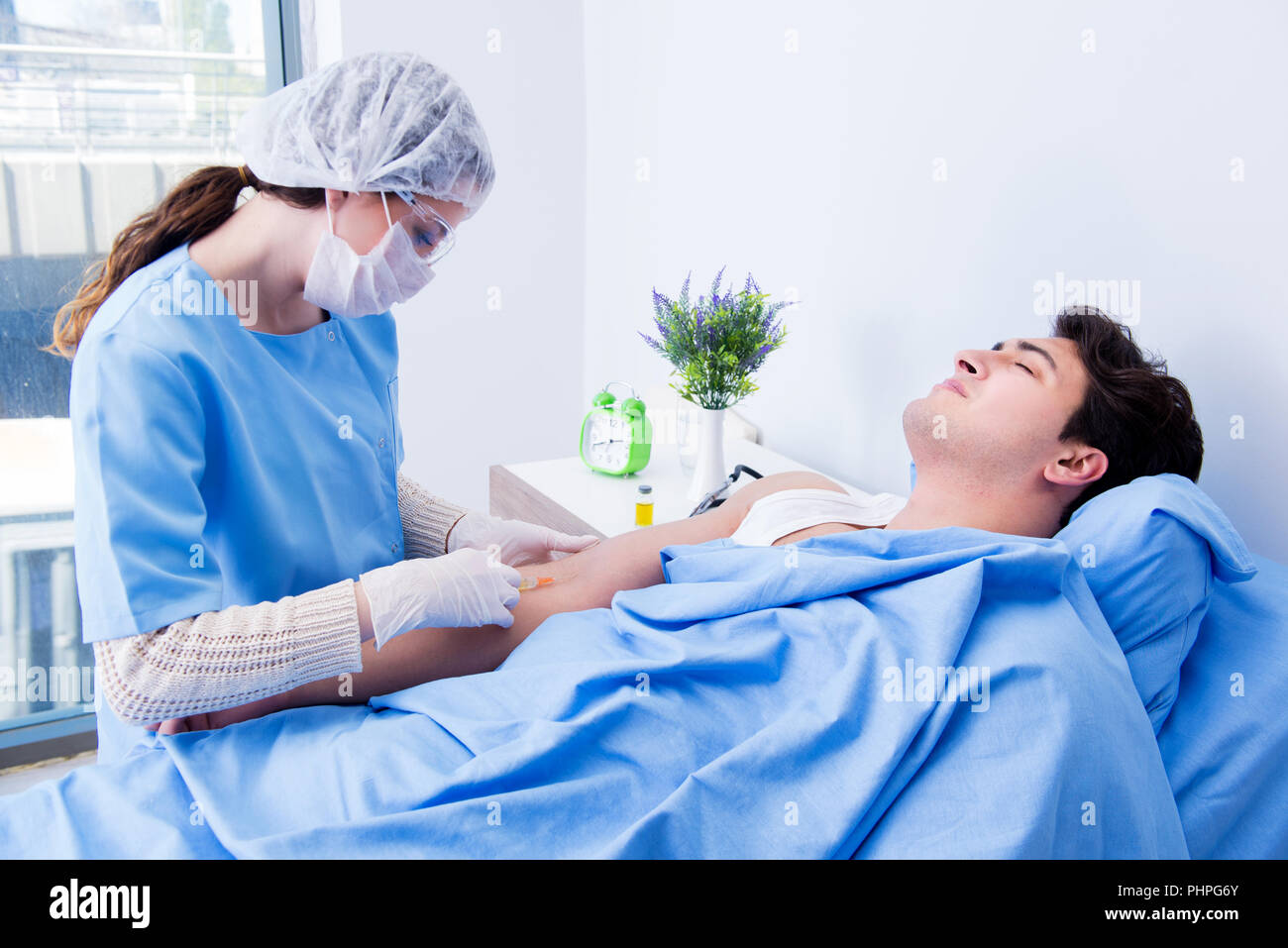 Doctor doing medical injection in hospital room Stock Photo - Alamy