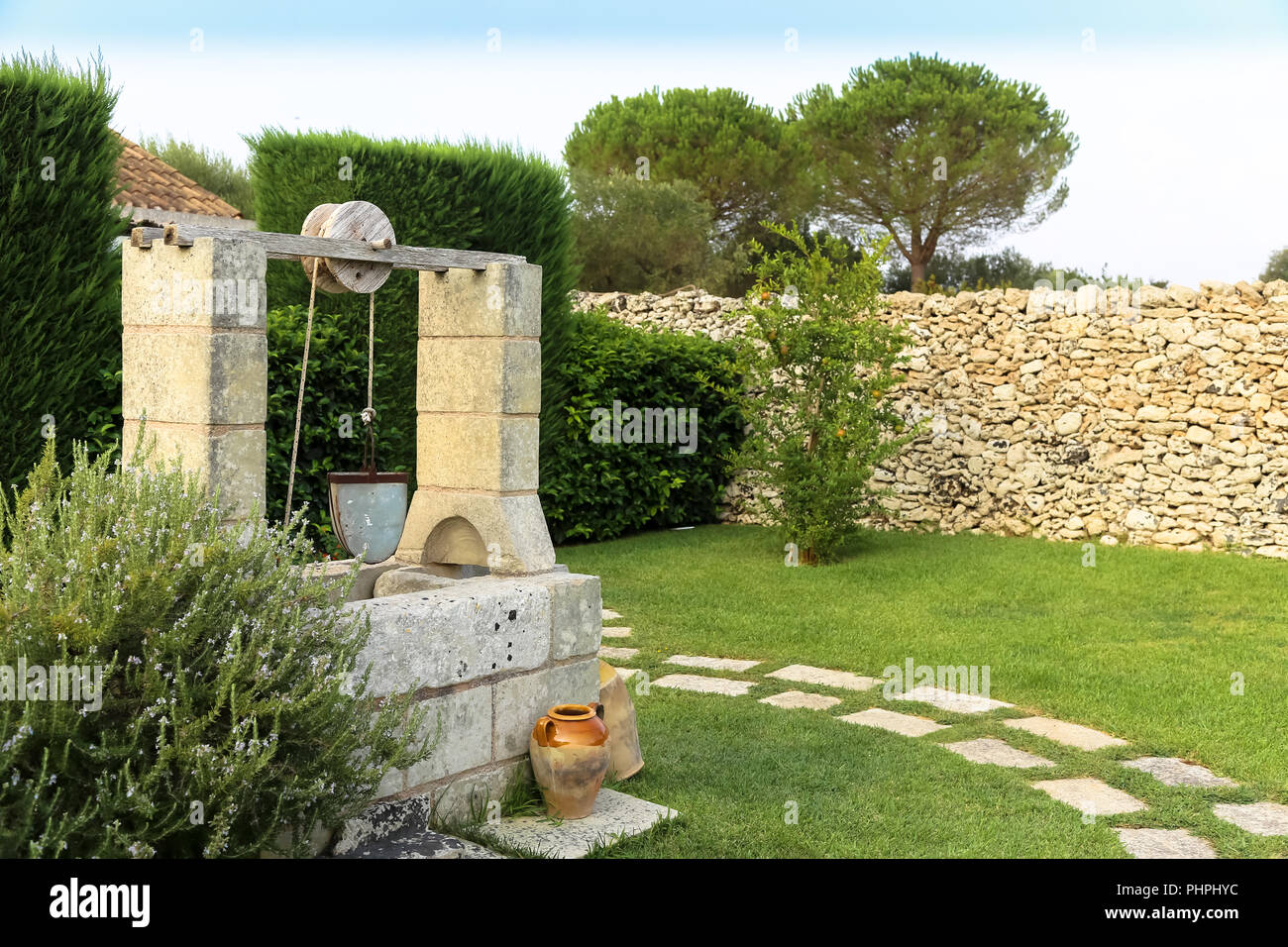 Vintage water well Stock Photo - Alamy