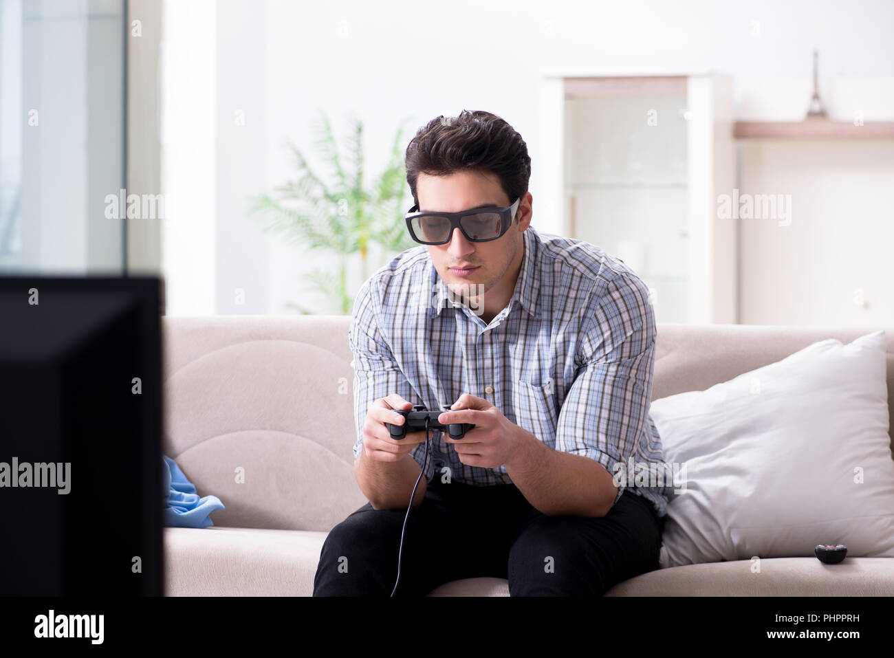 Man playing 3d games at home Stock Photo - Alamy