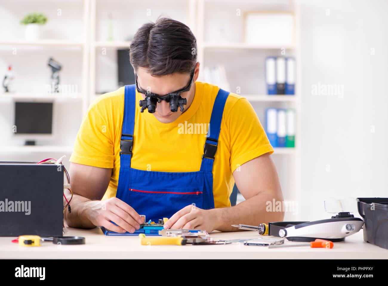 Computer repair technician repairing hardware Stock Photo - Alamy