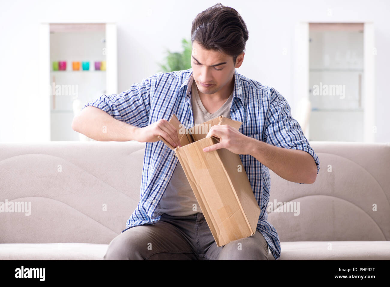 Man receiving empty parcel with stolen goods Stock Photo - Alamy