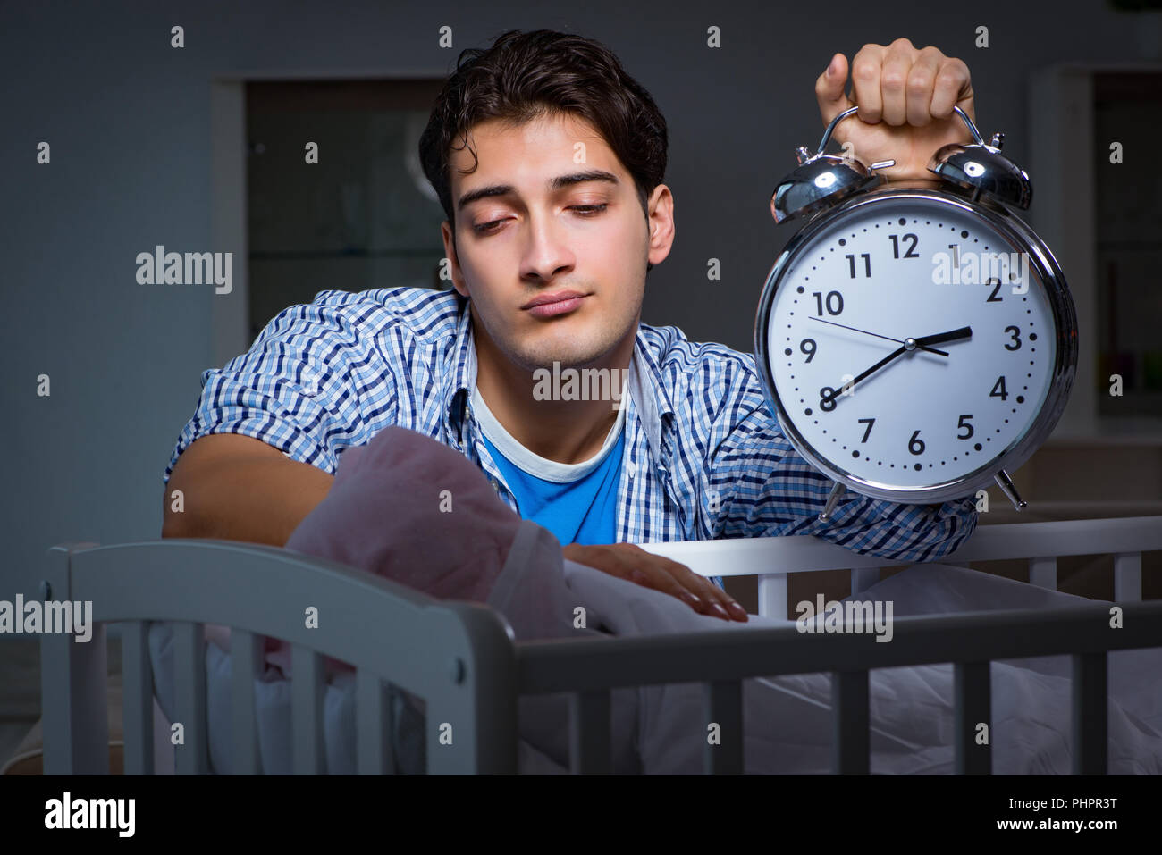 Young father dad sleeping while looking after newborn baby Stock Photo ...