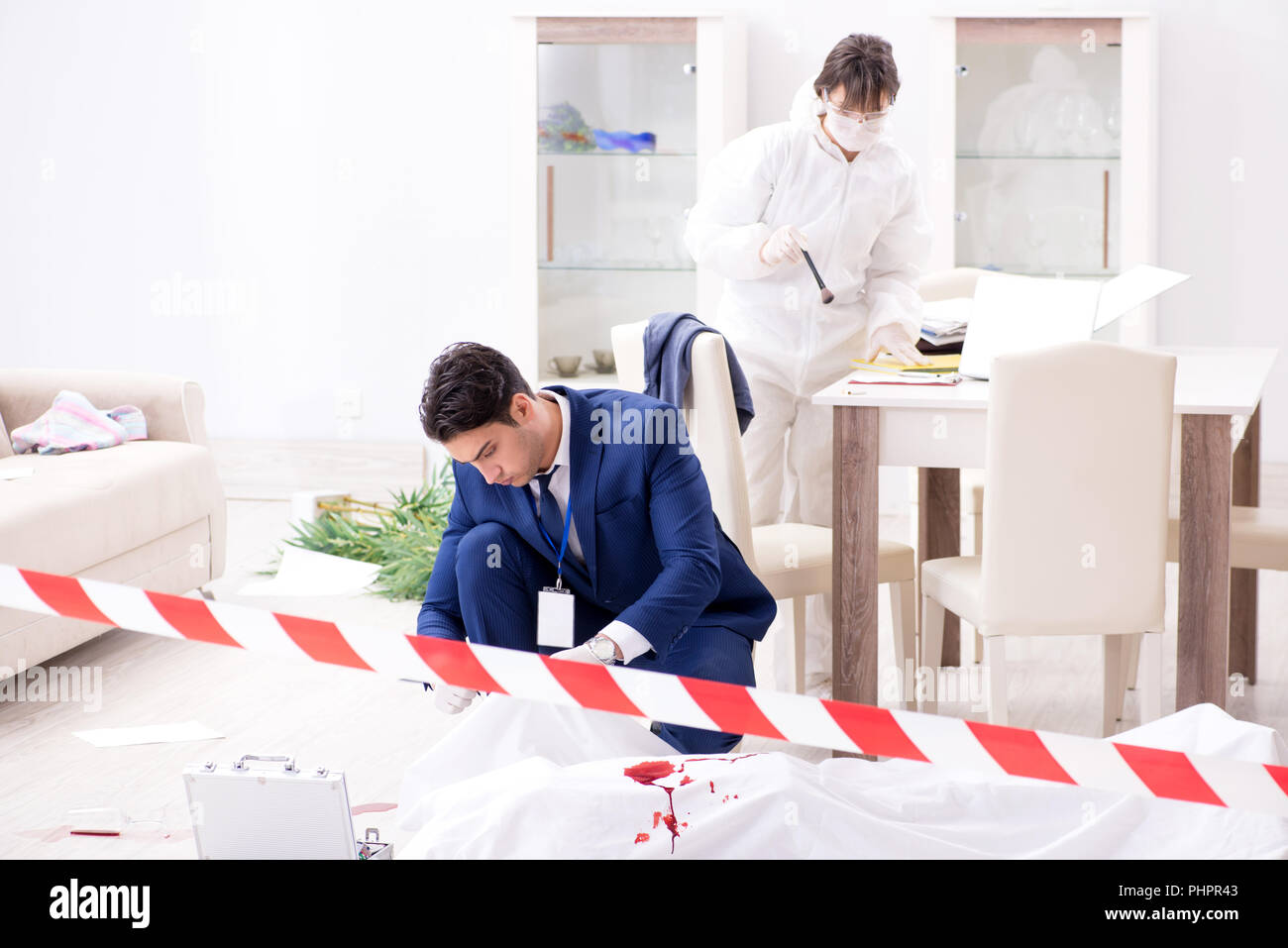 Forensics investigator at the scene of office crime Stock Photo - Alamy