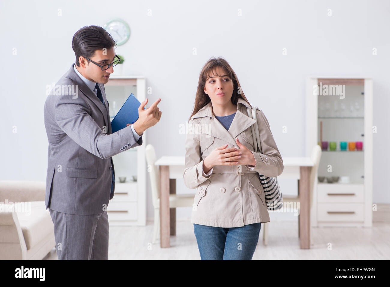 Real estate agent showing new apartment property to client Stock Photo ...