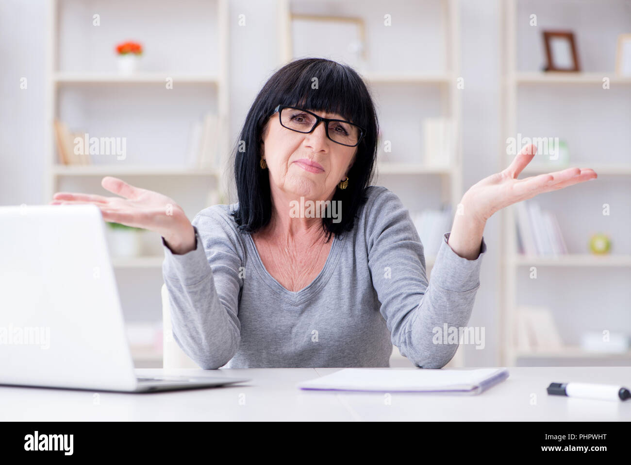Senior woman struggling at computer Stock Photo - Alamy