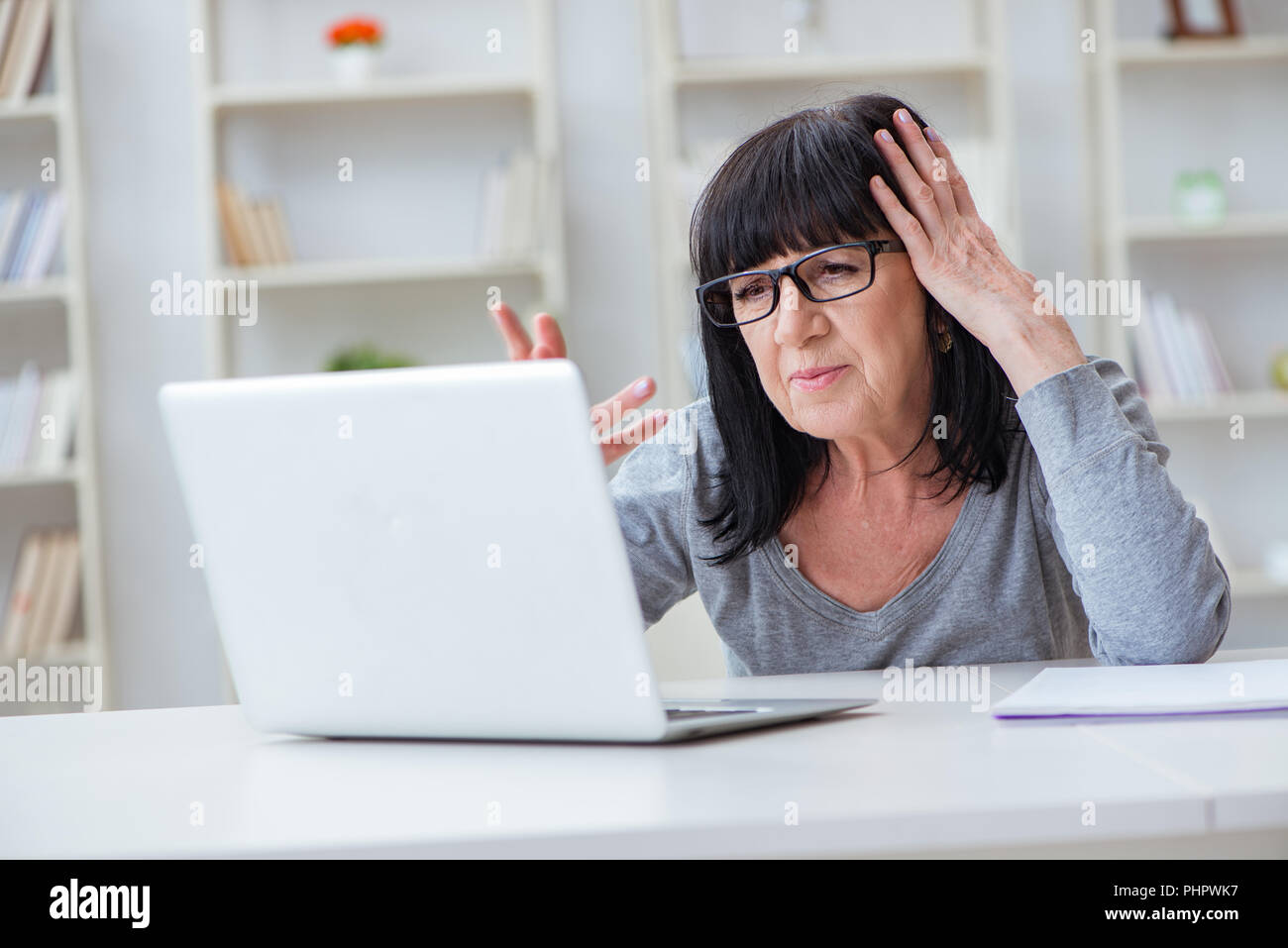 Senior woman struggling at computer Stock Photo - Alamy