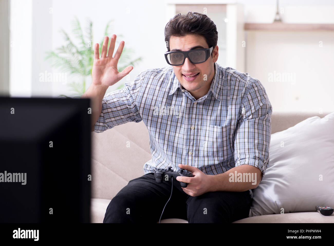 Man playing 3d games at home Stock Photo - Alamy