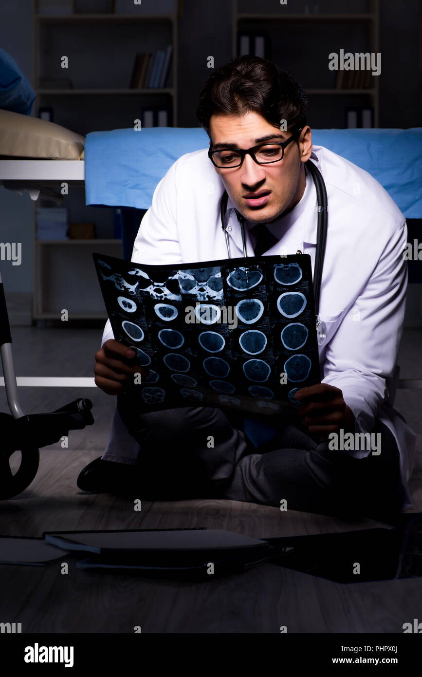 Doctor working night shift in hospital after long hours Stock Photo - Alamy