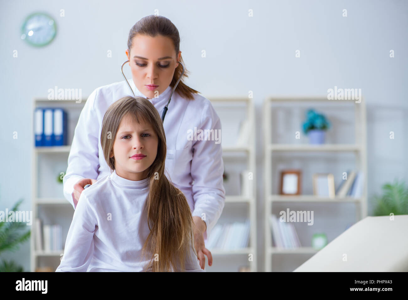 Female doctor pediatrician checking girl Stock Photo - Alamy Female doctor pediatrician checking girl Stock Photo - Alamy