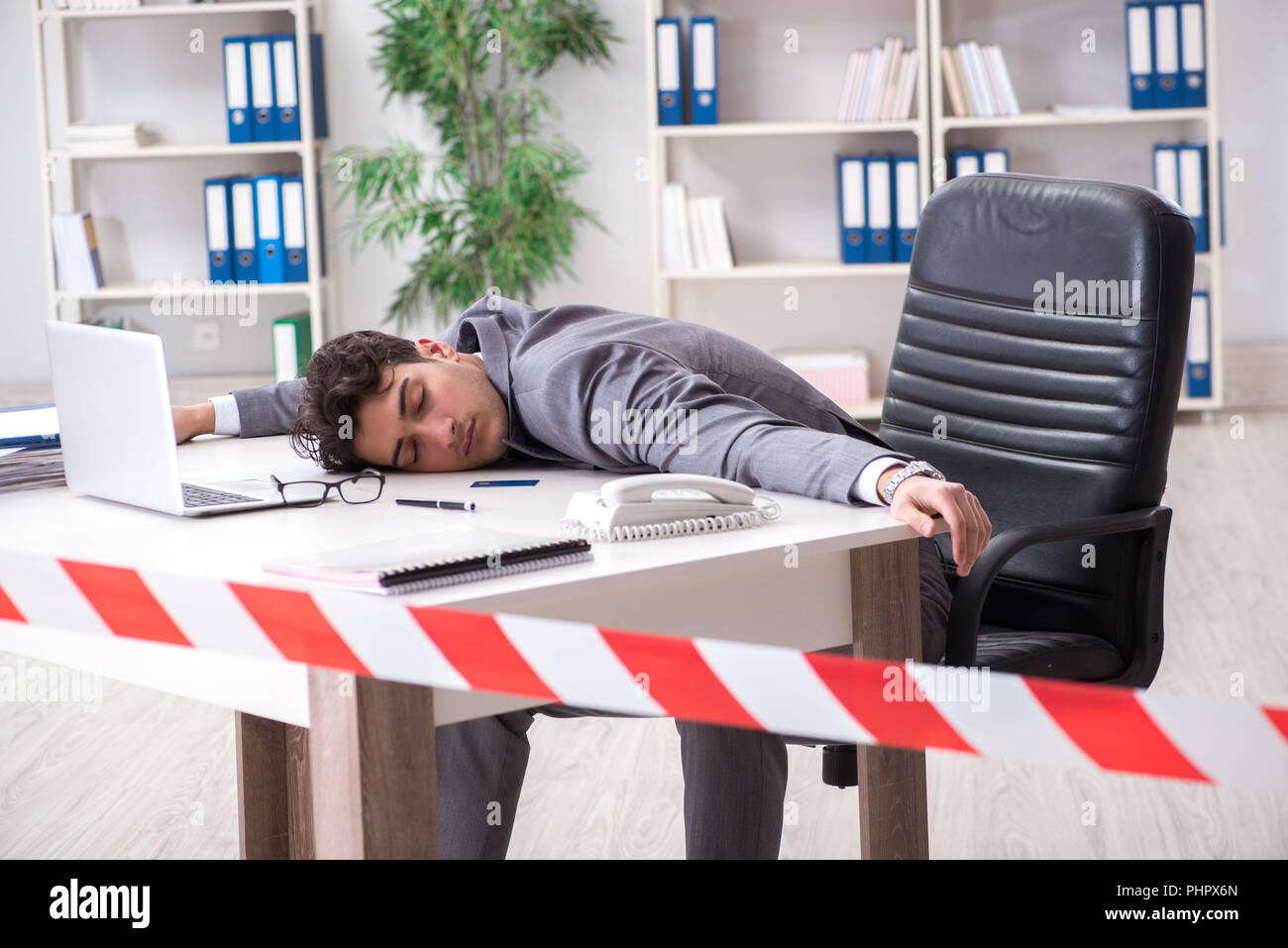 Dead businessman at this desk Stock Photo - Alamy