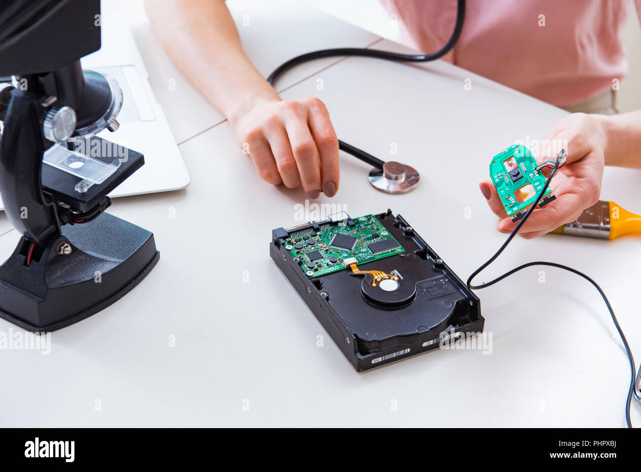 Hard drive repair and data recovery with restoration Stock Photo - Alamy