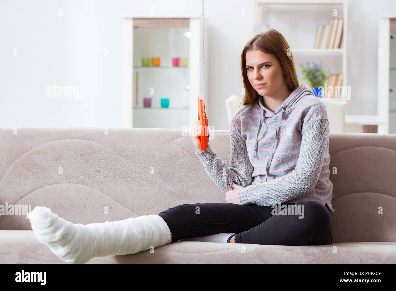 Young woman with broken leg at home Stock Photo - Alamy