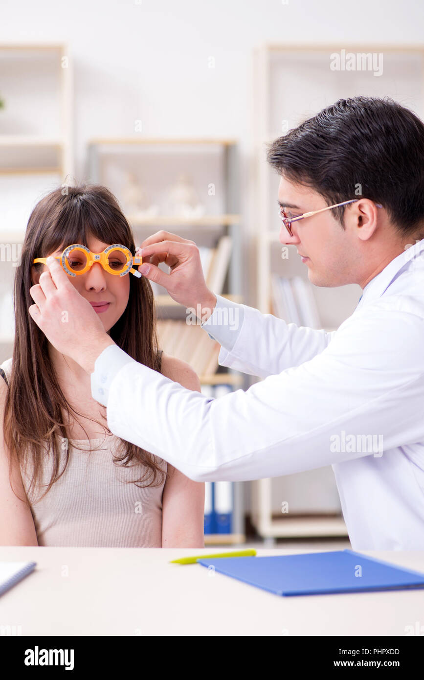 Ophthalmologist is checking up patient in eye doctor hospital Stock ...