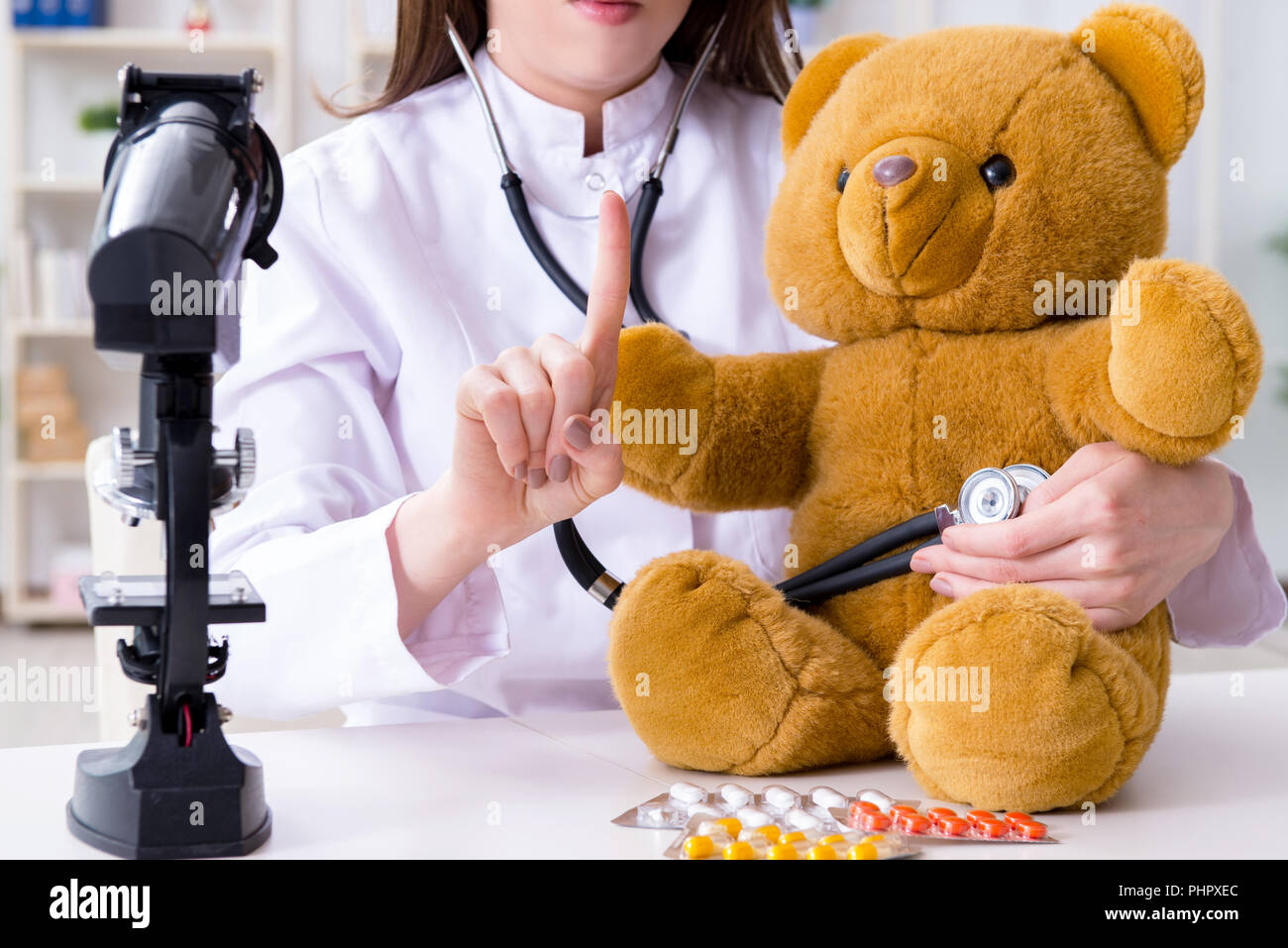 Child checking soft toy health Stock Photo - Alamy