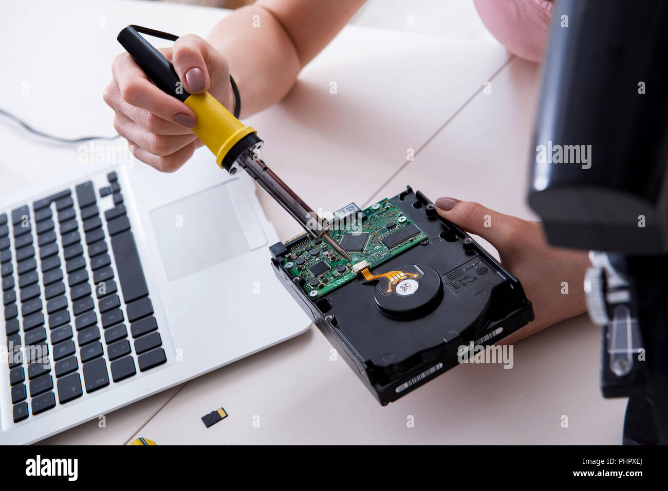 Hard drive repair and data recovery with restoration Stock Photo - Alamy