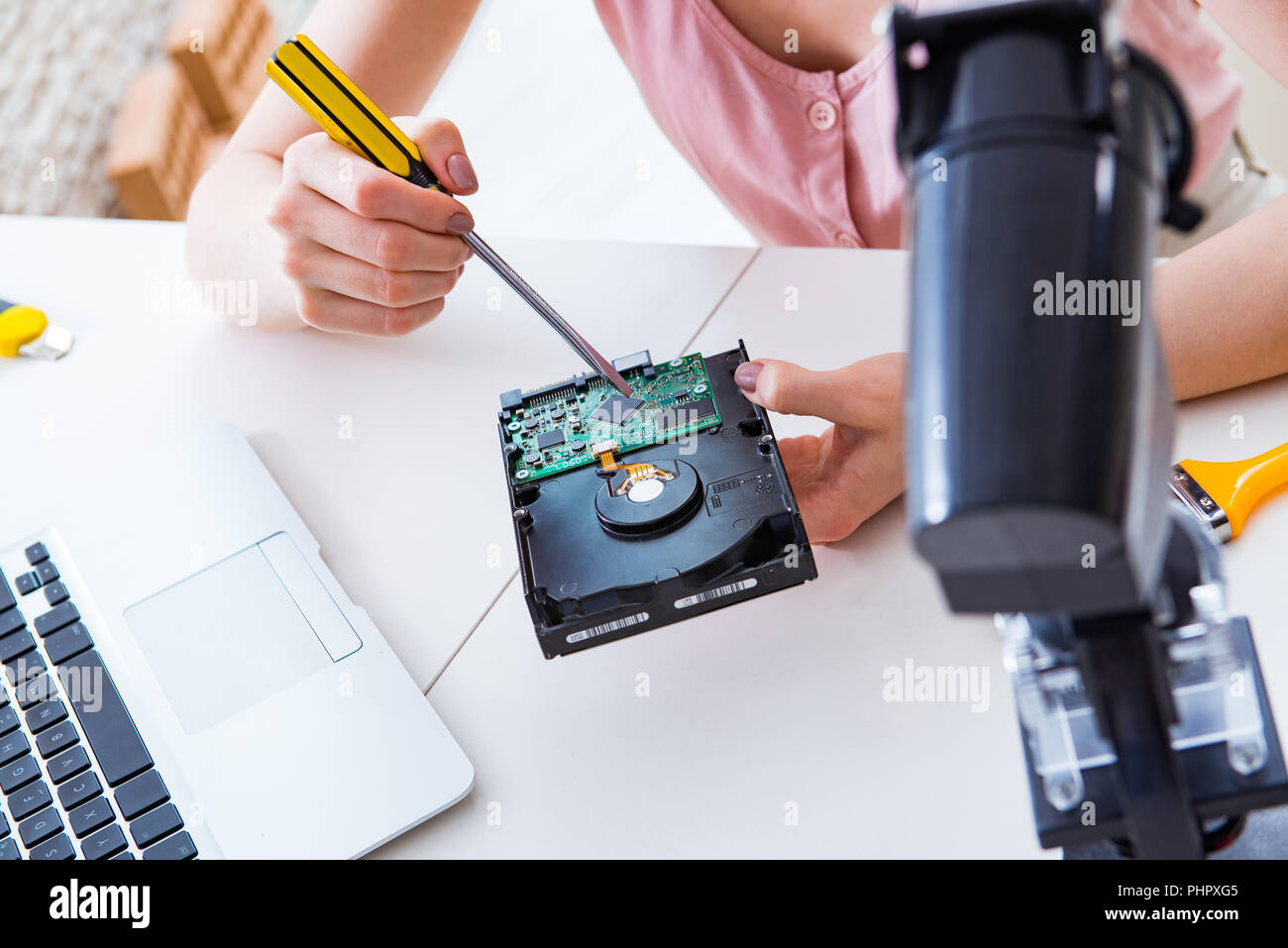 Hard drive repair and data recovery with restoration Stock Photo - Alamy