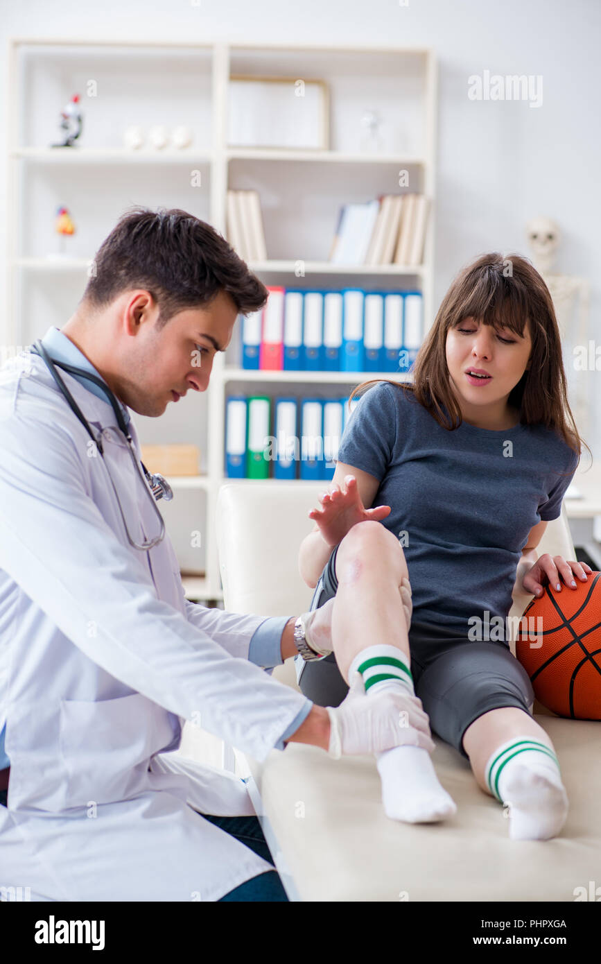Female basketball player visiting doctor after injury Stock Photo - Alamy