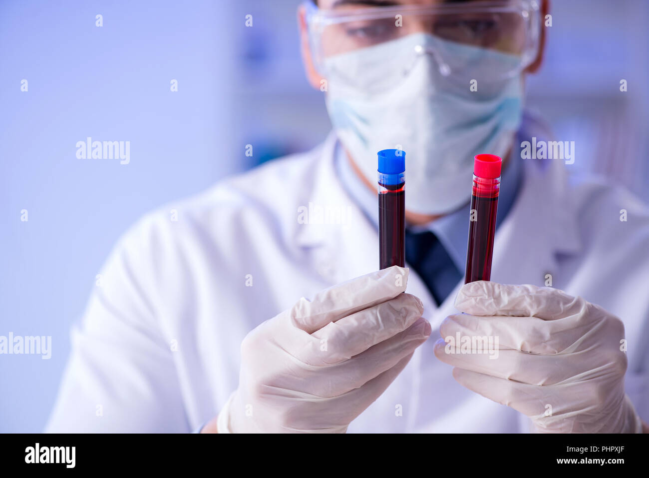Lab assistant testing blood samples in hospital Stock Photo - Alamy