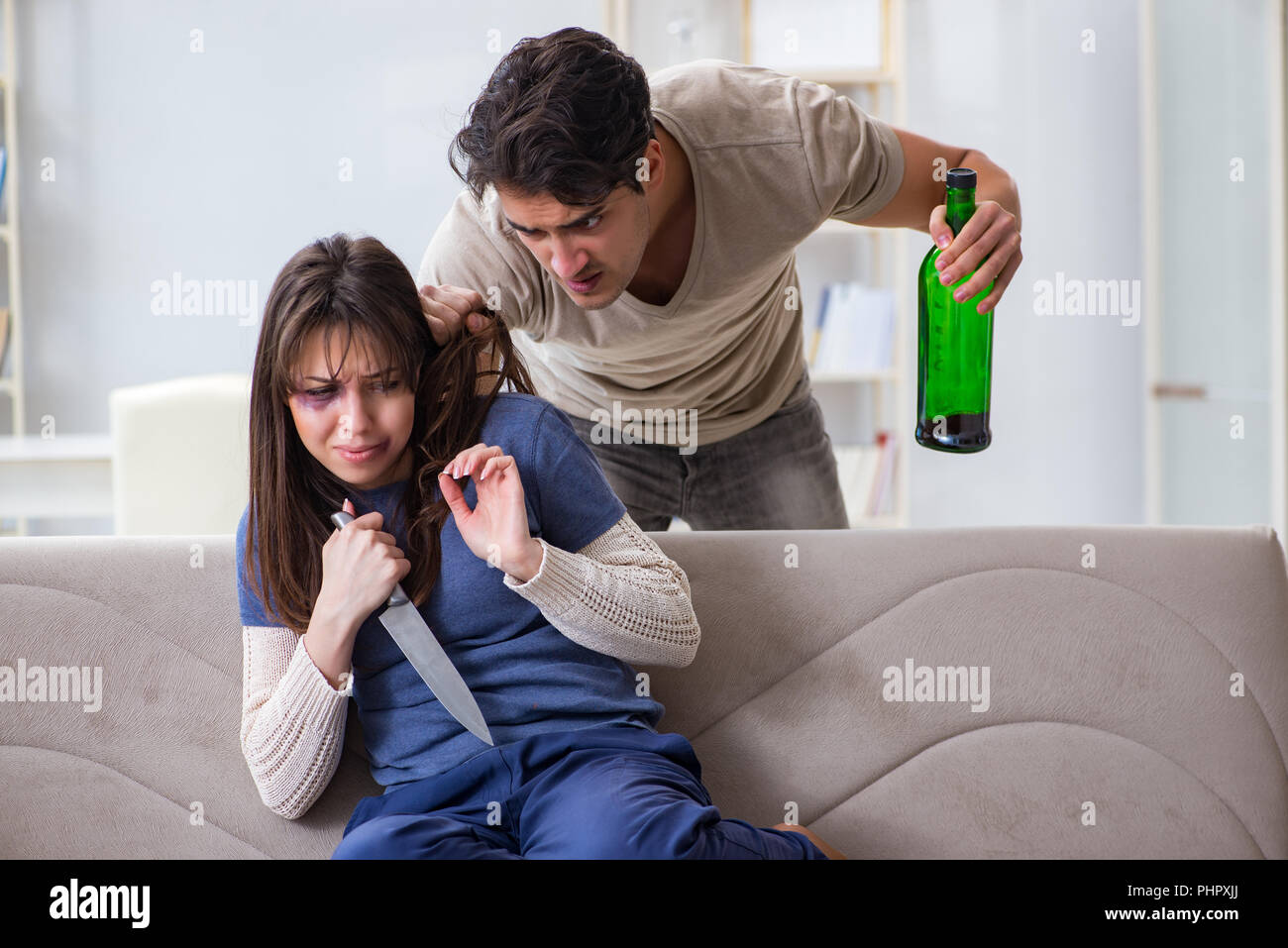 Desperate wife attempting to kill husband Stock Photo - Alamy