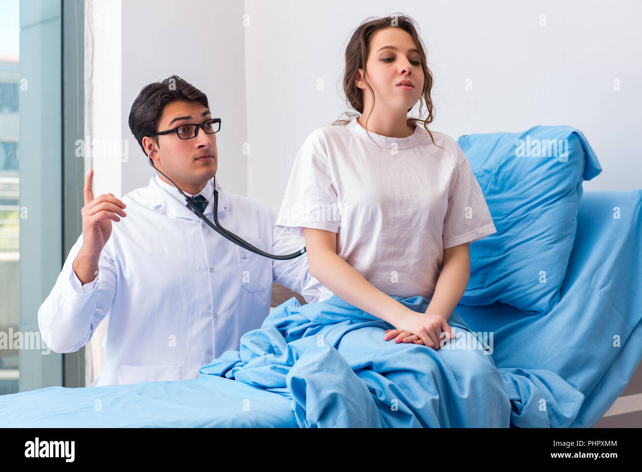 Doctor visiting patient in hospital room Stock Photo - Alamy