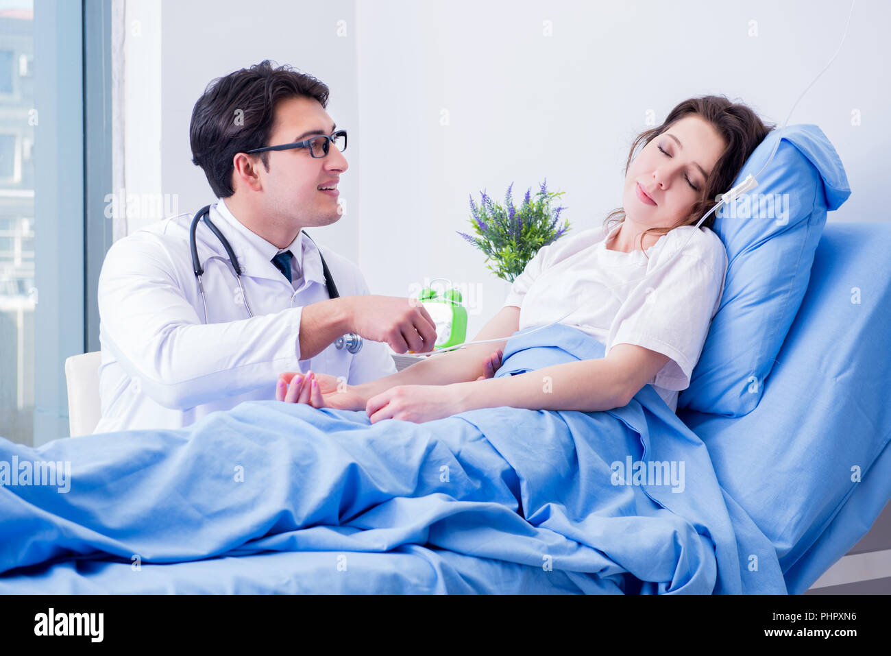 Doctor doing medical injection in hospital room Stock Photo - Alamy