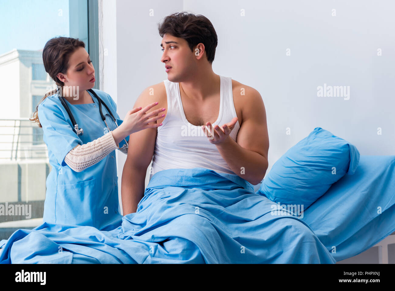 Doctor visiting patient in hospital room Stock Photo - Alamy