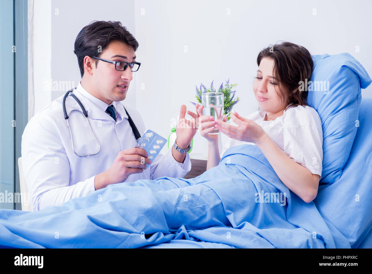 Doctor checking patient pills in hi-res stock photography and images ...