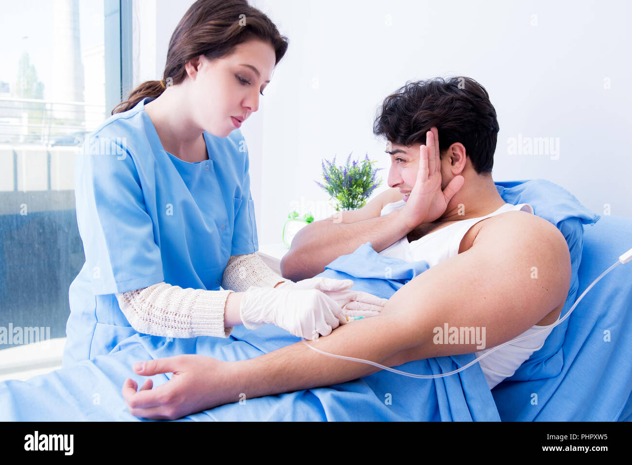 Doctor doing medical injection in hospital room Stock Photo - Alamy